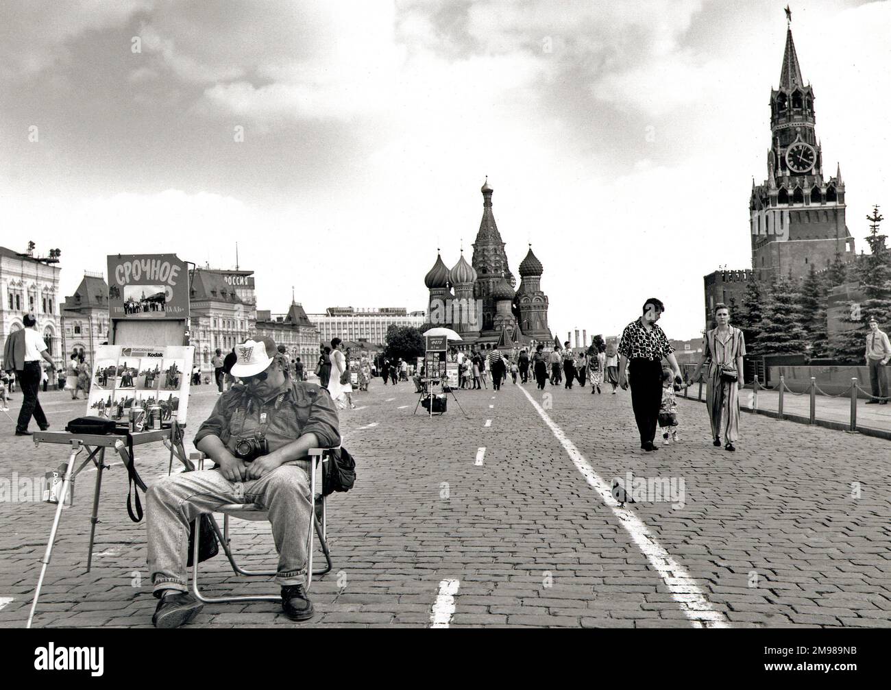 Scene in Red Square, Moscow, Russia, with a photographer asleep in a ...
