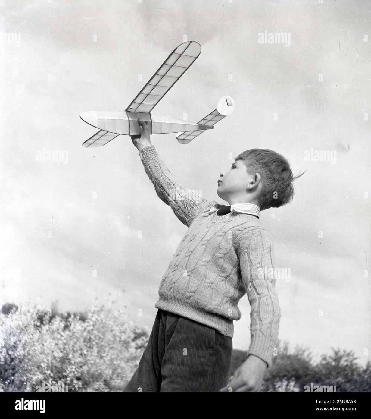 Boy with a model aeroplane -- one of a series of images taken by Adams ...