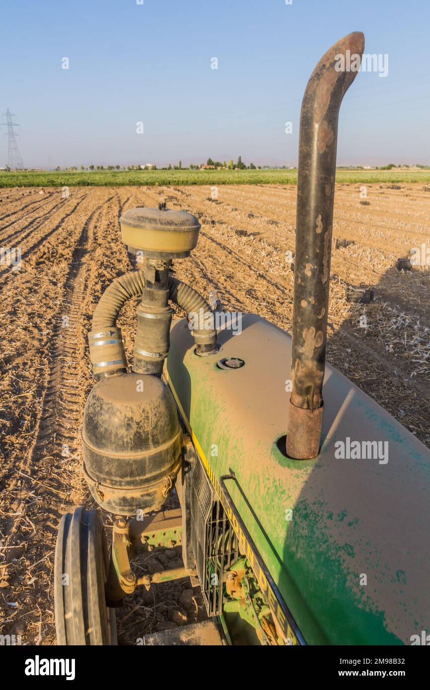 Tractor on a garlic field near Bahar, Iran Stock Photo - Alamy
