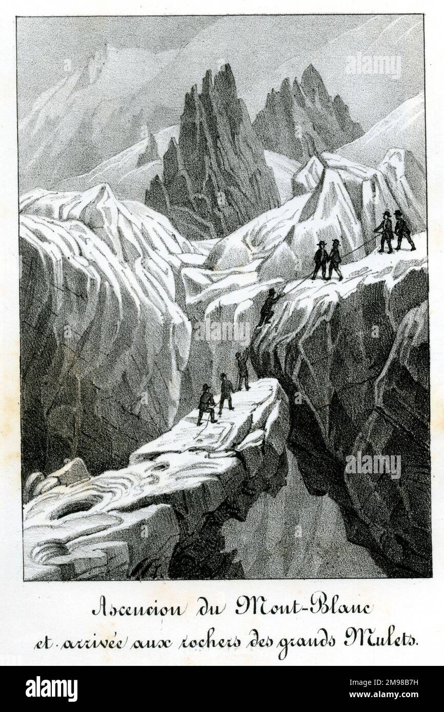 Climbers ascending Mont Blanc and arriving at the Grands Mulets rocks ...