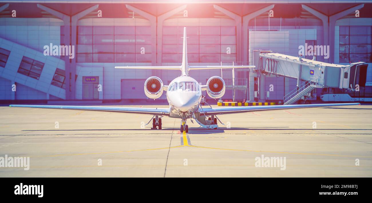 Silver shiny airplane at runway Stock Photo - Alamy