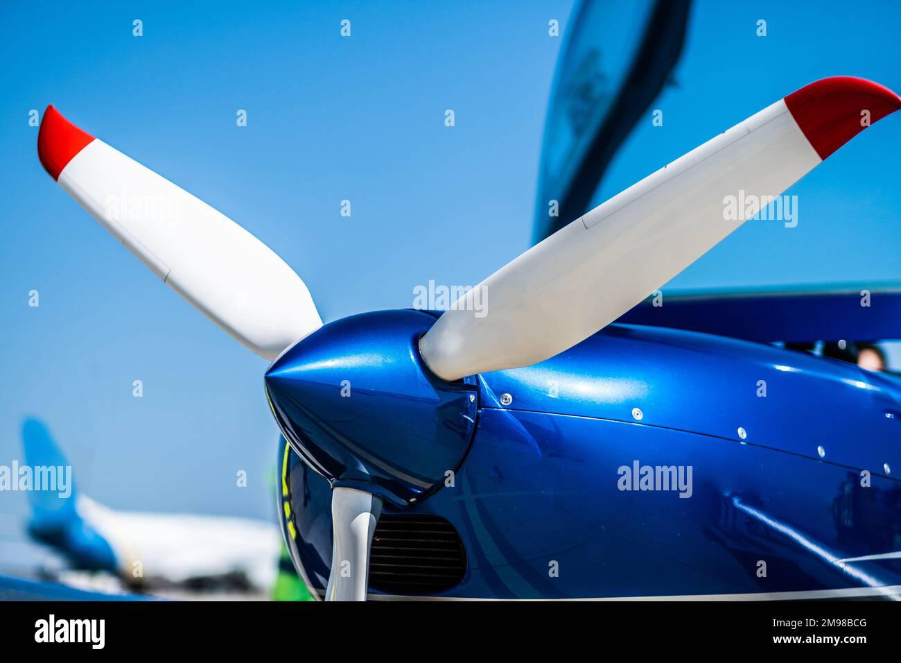Closeup view of white propeller of the blue sport plane nose Stock ...