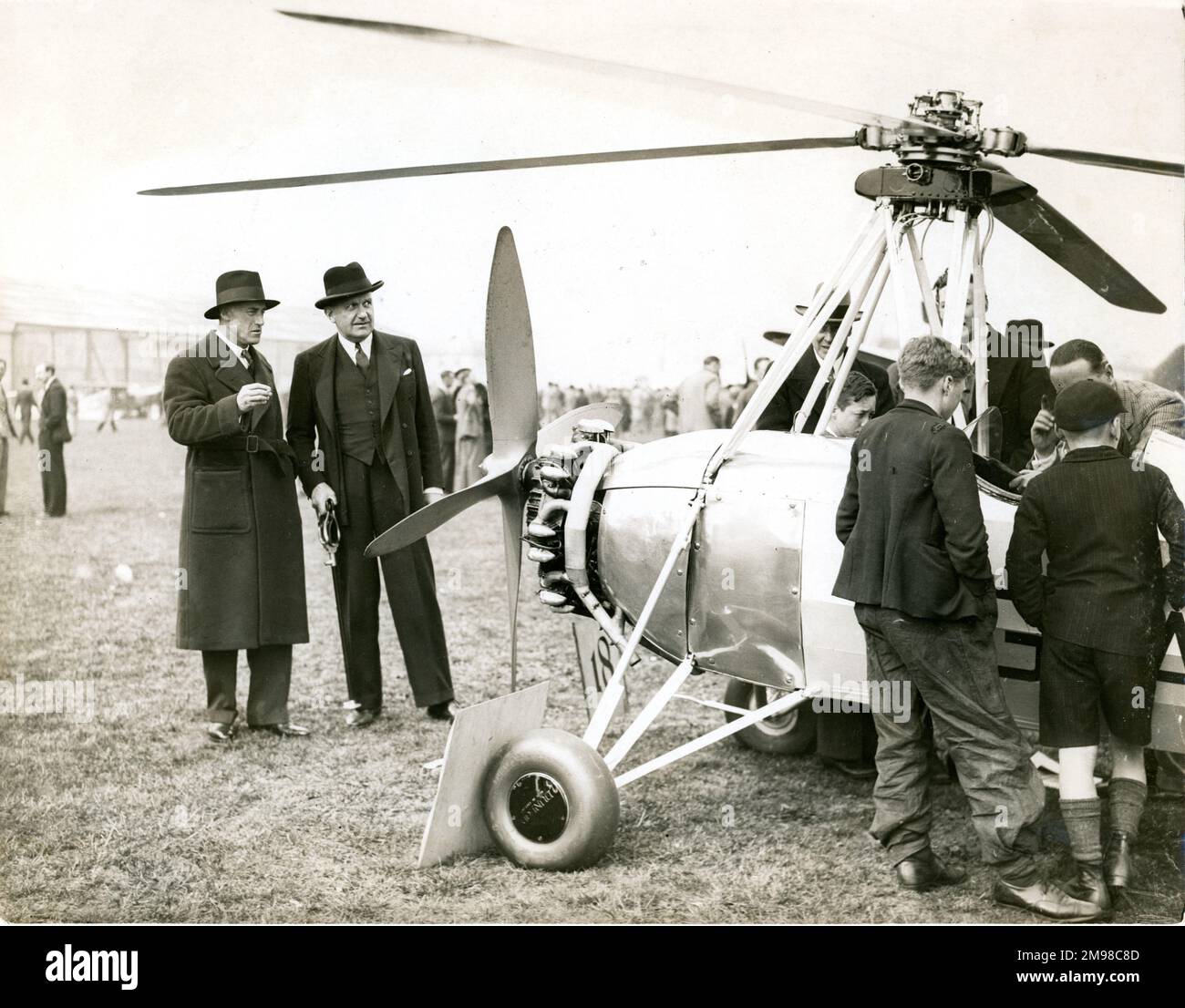 Viscount Swinton, left, and Frederick Handley Page inspect a Kay ...