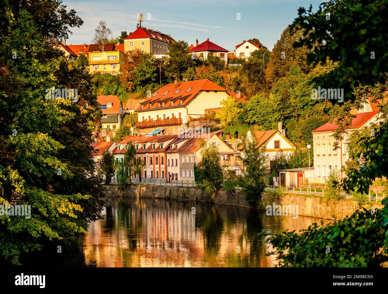 Evening sunlight senery of river and old buildings Stock Photo - Alamy