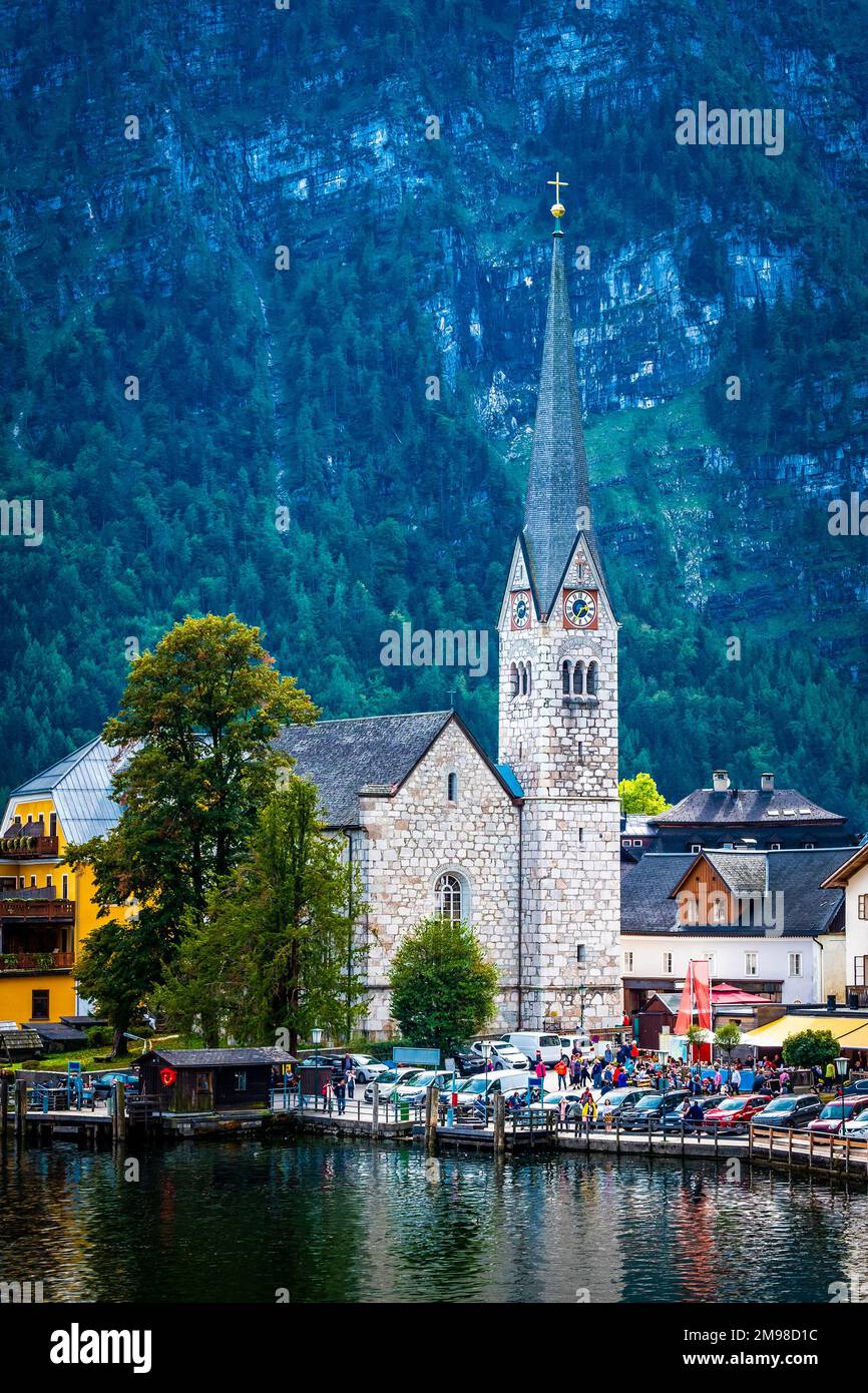 Amazing view of protestant church clock tower in Hallstatt, Austria ...