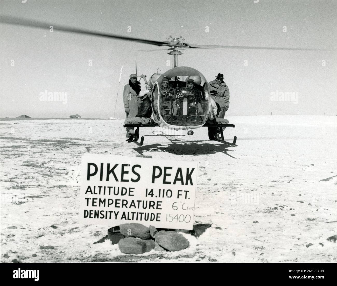 Bell Model 47G-3 hovers atop Pikes Peak with pilot and five passengers ...