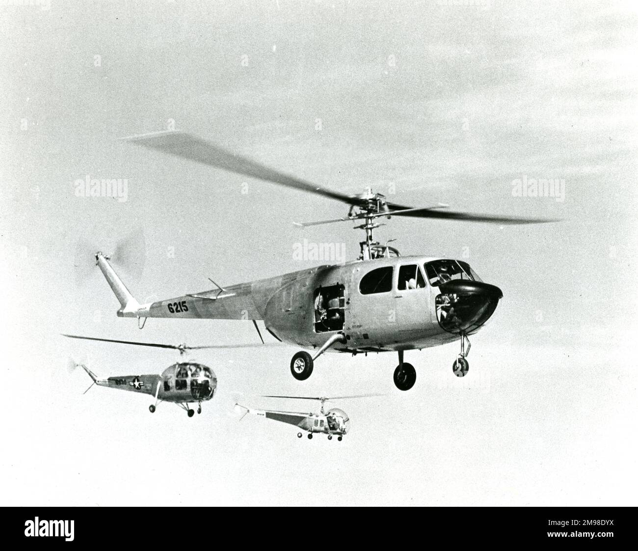 Bell Model 48 XR-12, 46-215, in the foreground, Bell XH-15, 46-530 in ...