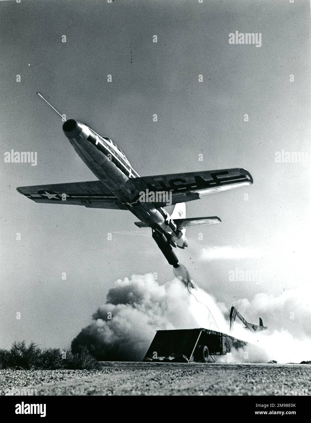 A Republic F-84 Thunderjet is launched from a Martin Aircraft zero ...
