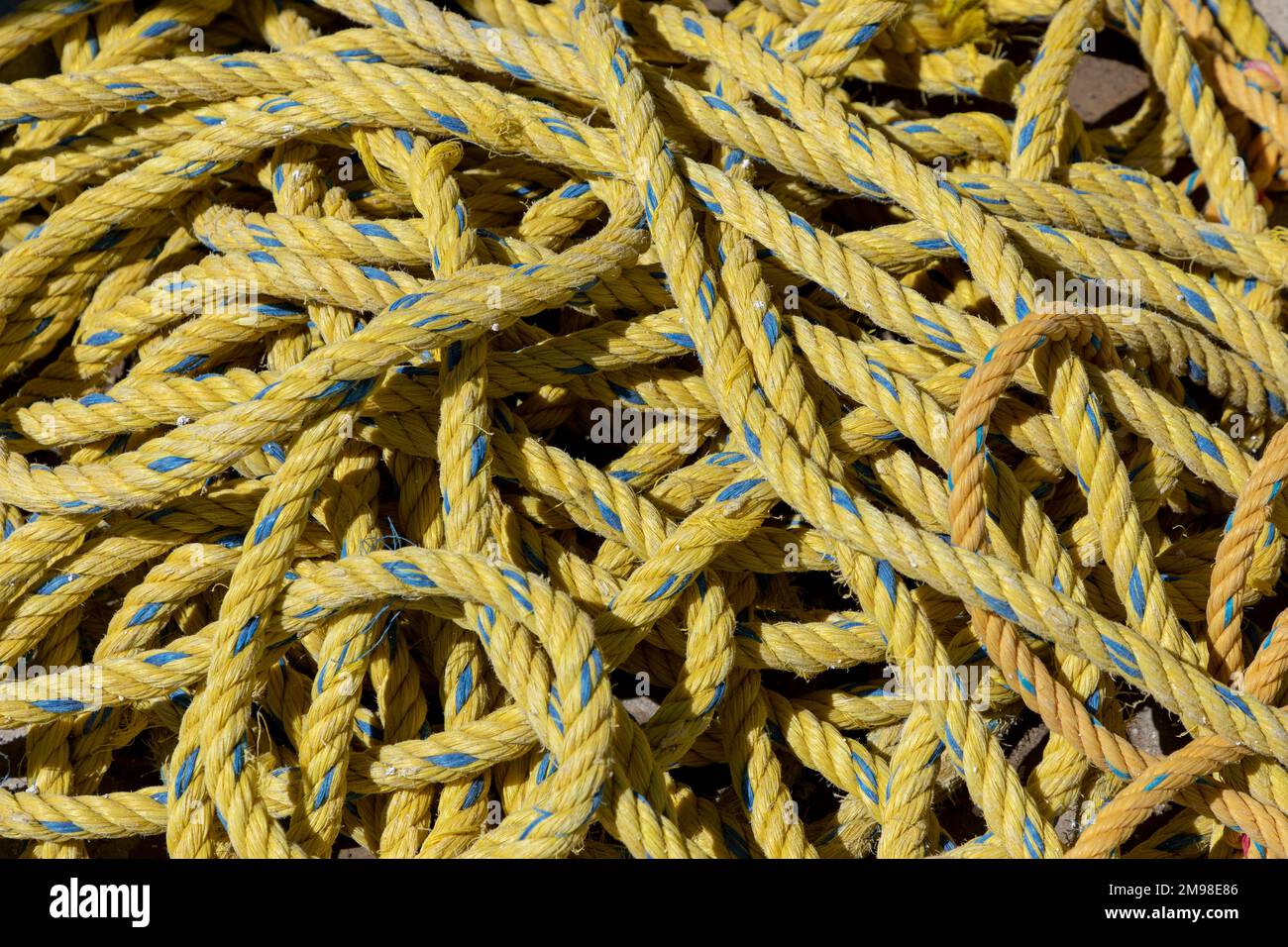 Yellow polymer rope texture in a construction Stock Photo - Alamy