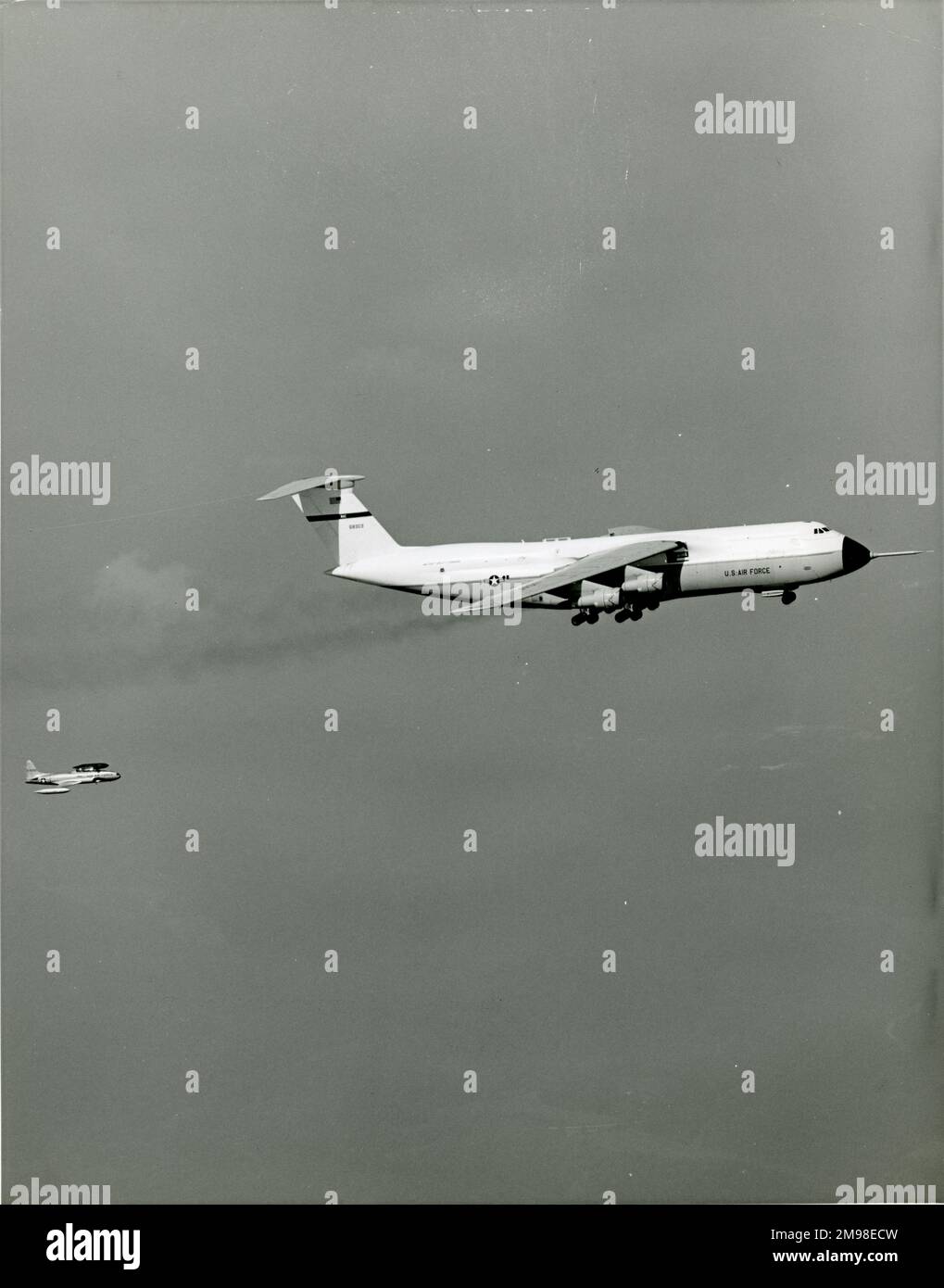 The first Lockheed C-5A Galaxy, 66-8303, with a Lockheed T-33 chase ...