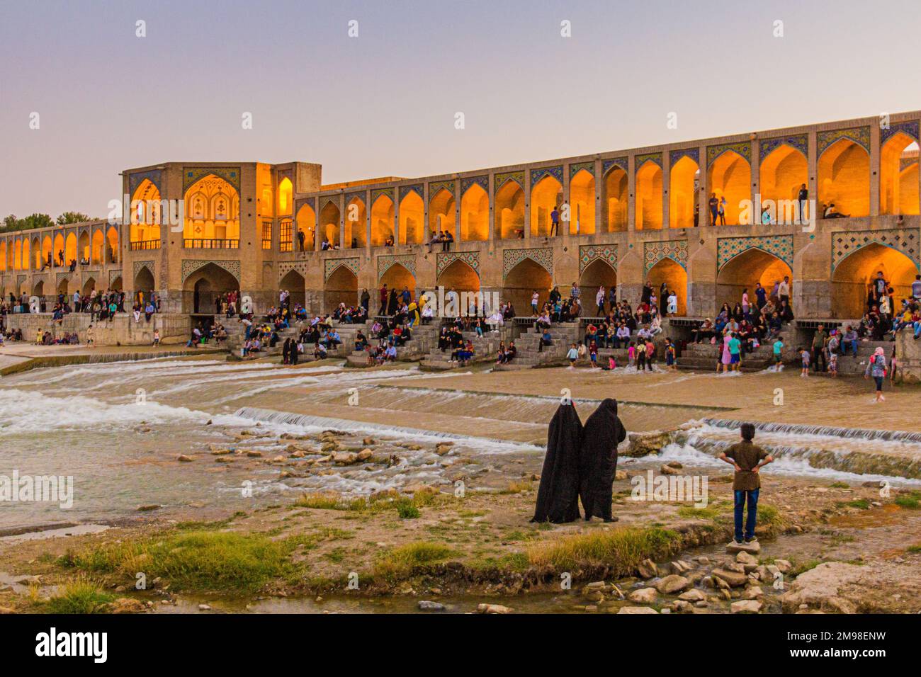 ISFAHAN, IRAN - JULY 9, 2019: People enjoying evening at Khaju bridge ...