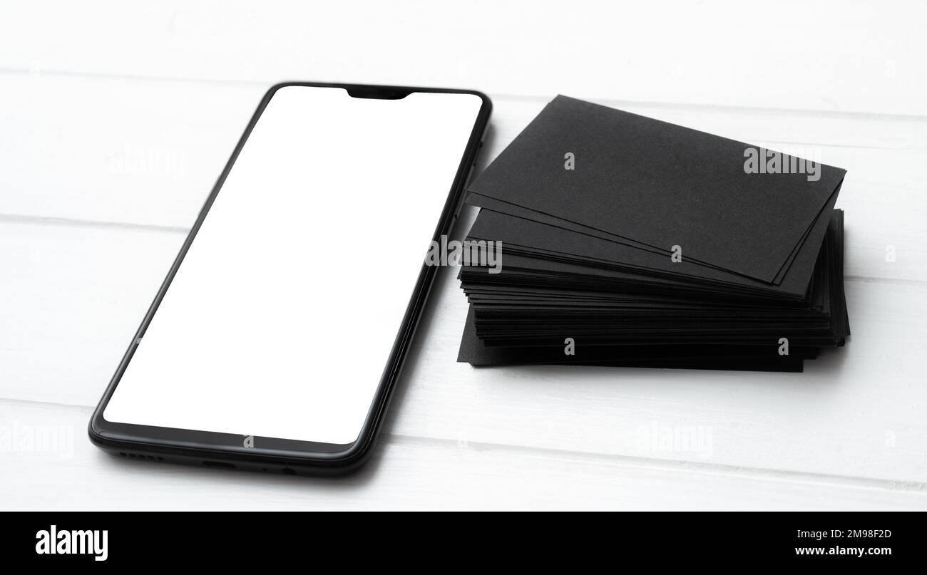 Blank of modern smartphone and black business cards stack for your ...