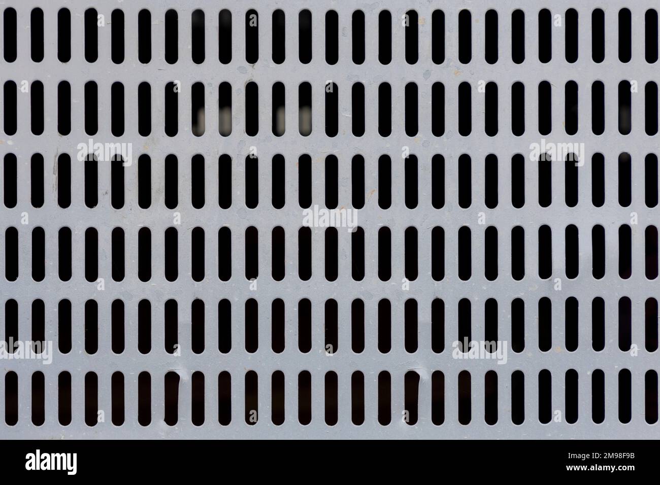 Perforated gray laminate texture and background Stock Photo - Alamy