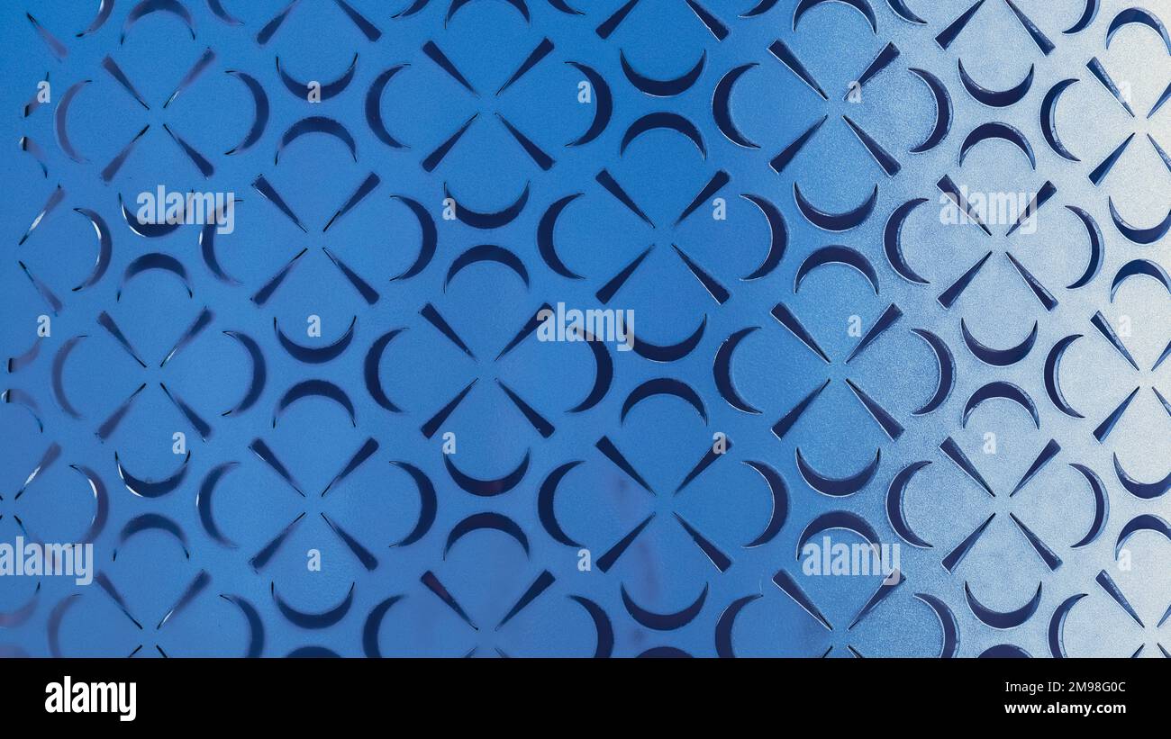 Cut out pattern with some wear in pressed metal with sun induced ...