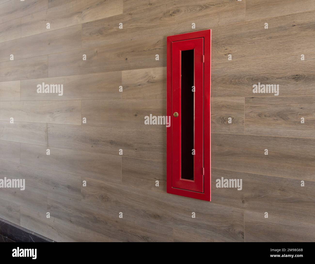 Firefighting shot in hallway of building on a brown marble wall Stock ...