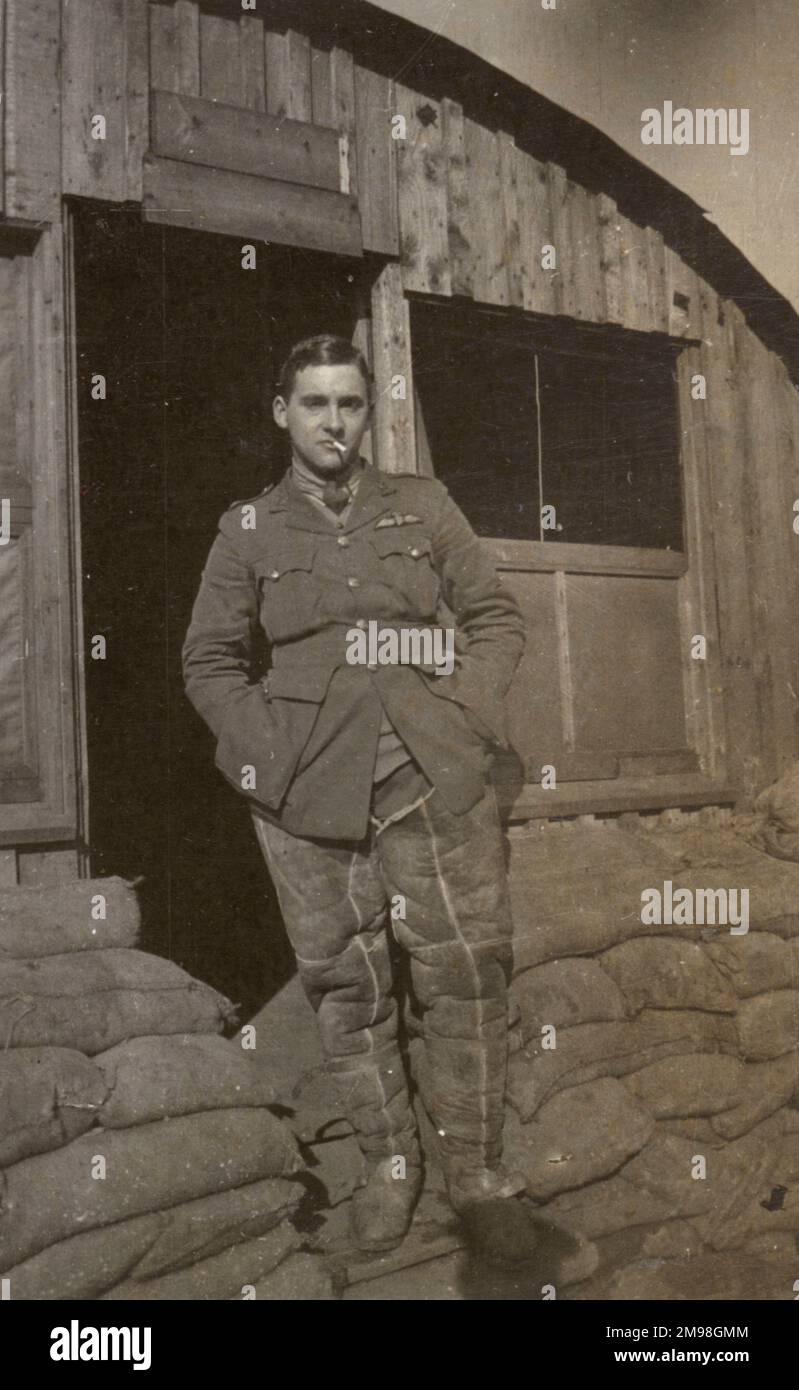 RFC crewman (Harold Auerbach) standing outside a hut at camp in ...