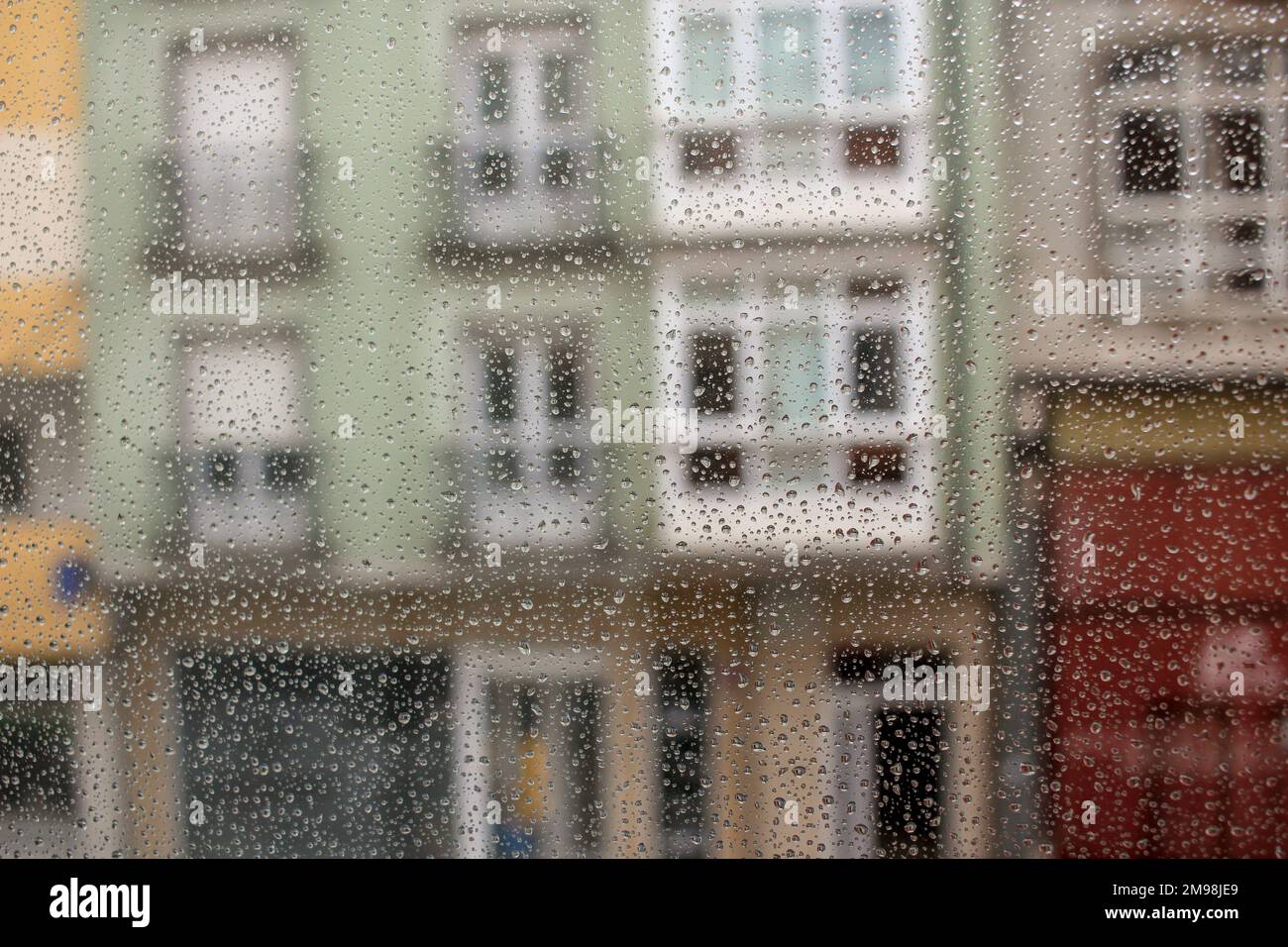 rainy day and droplets of rain in the kitchen window Stock Photo - Alamy