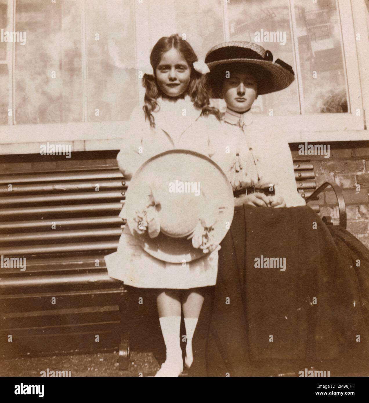 Two sisters (Violet and Lucy Auerbach) on a garden bench, summer 1910 ...