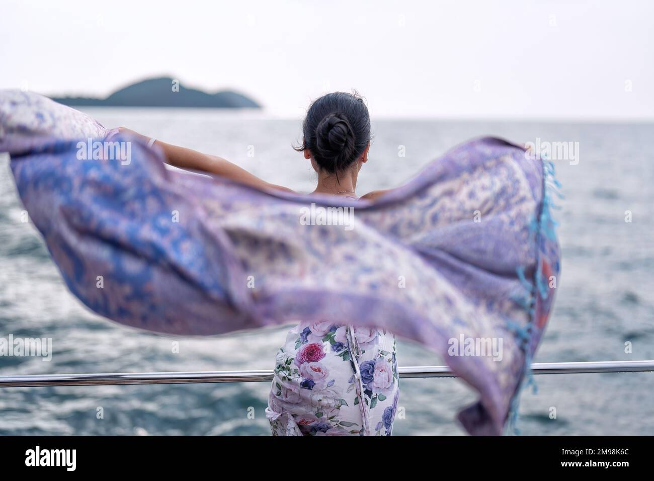 Beautiful girl have fun sailing in the sea sitting on yacht deck enjoy ...