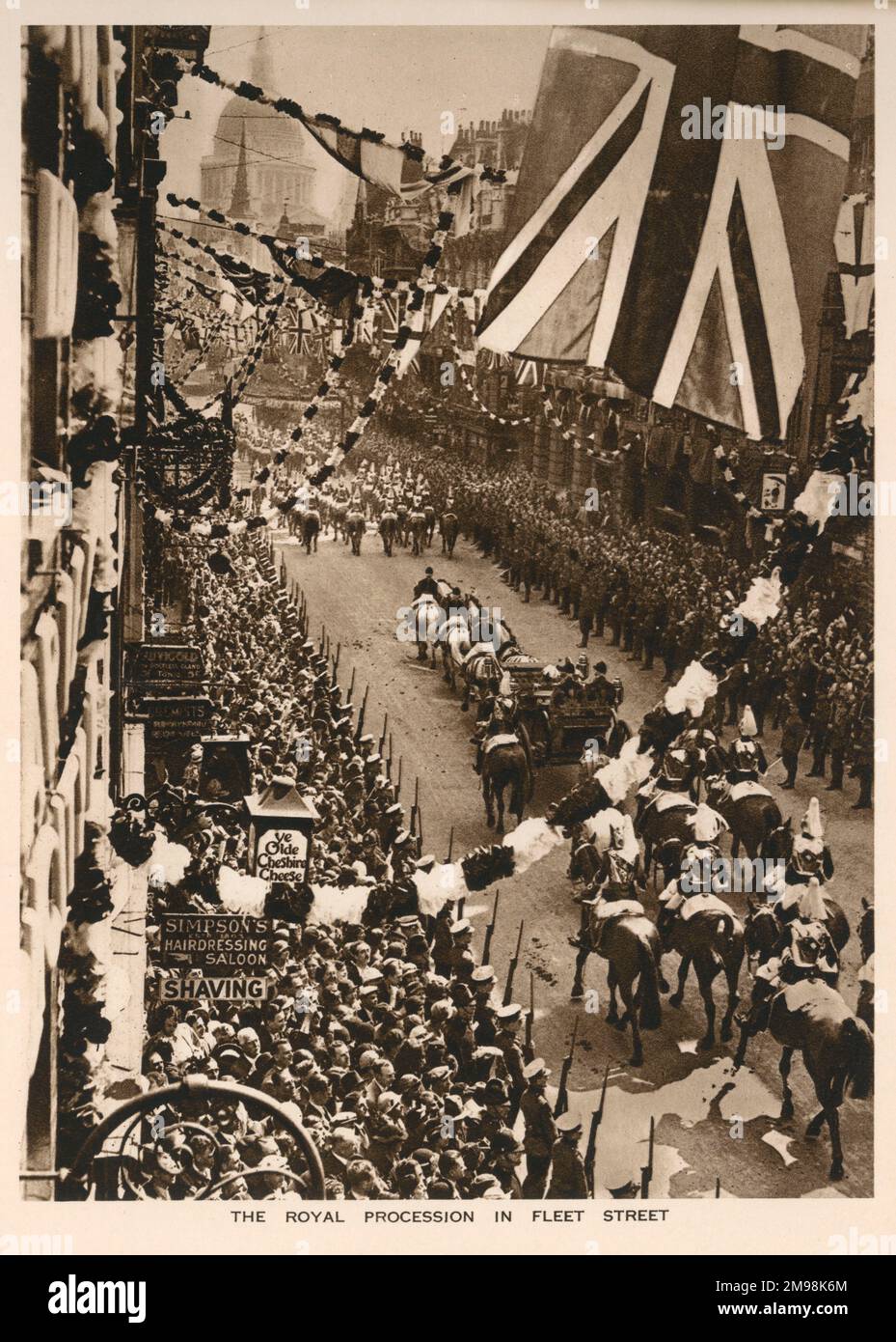 King George V and Queen Mary in an open carriage on their way to St Paul's Cathedral for the ...