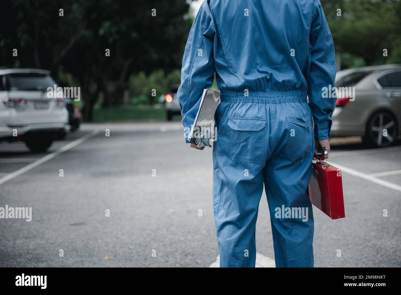 Back mechanic man maintenance with tools togo service repair outdoor ...