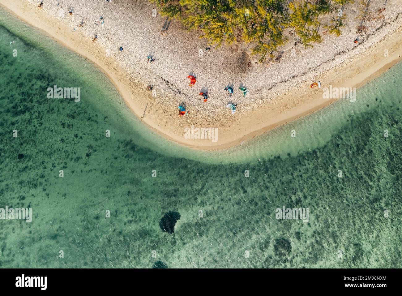 Colorful kites on Le Morne sandy beach with a turquoise clean lagoon ...