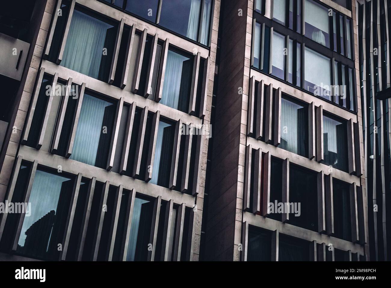 Detail of a generic modern building. Filtered background image of glass ...