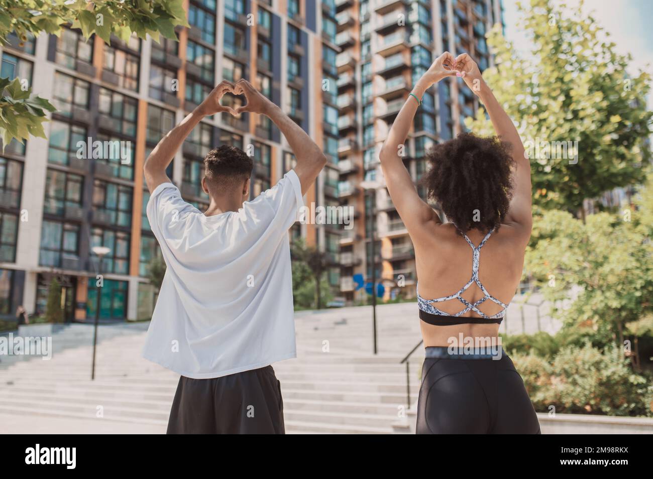 Athletes demonstrating their love for sports during an outdoor workout ...