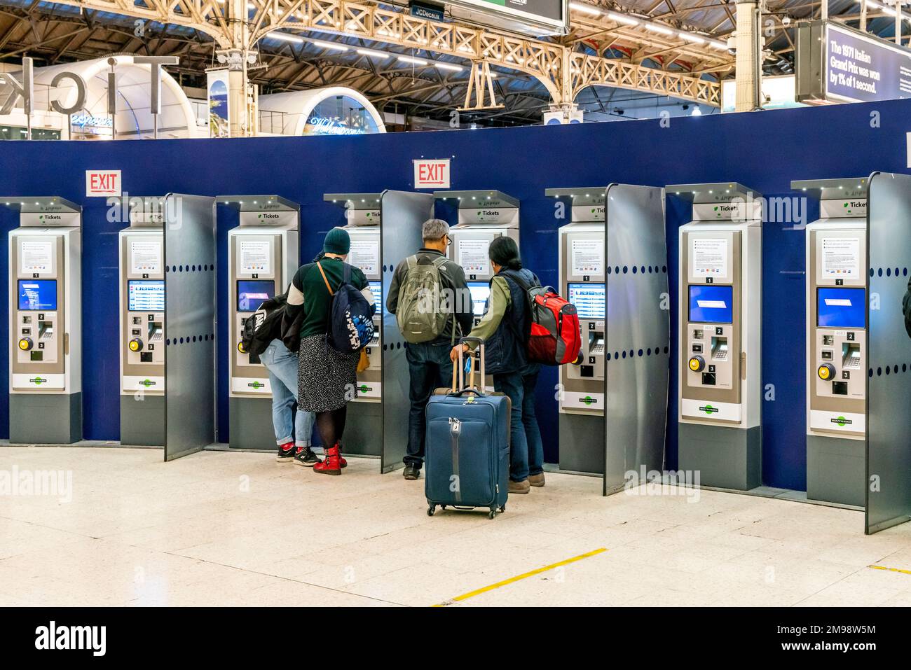 People Buying Train Tickets From Machines, Victoria Station, London, Uk ...