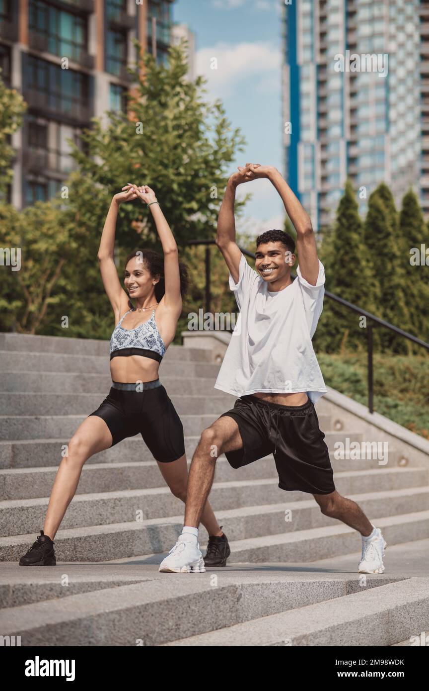 Two athletes working out on the stairs Stock Photo - Alamy