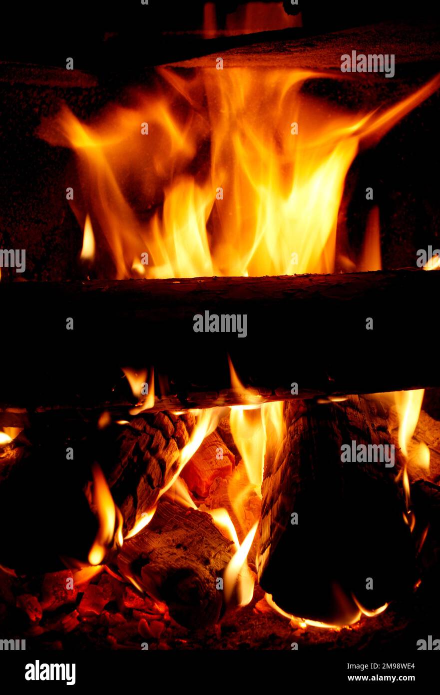Fire burning in a wood stove Stock Photo - Alamy