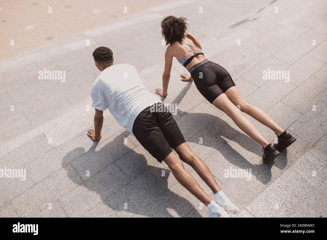 Athlete girl performing morning exercise hi-res stock photography and ...