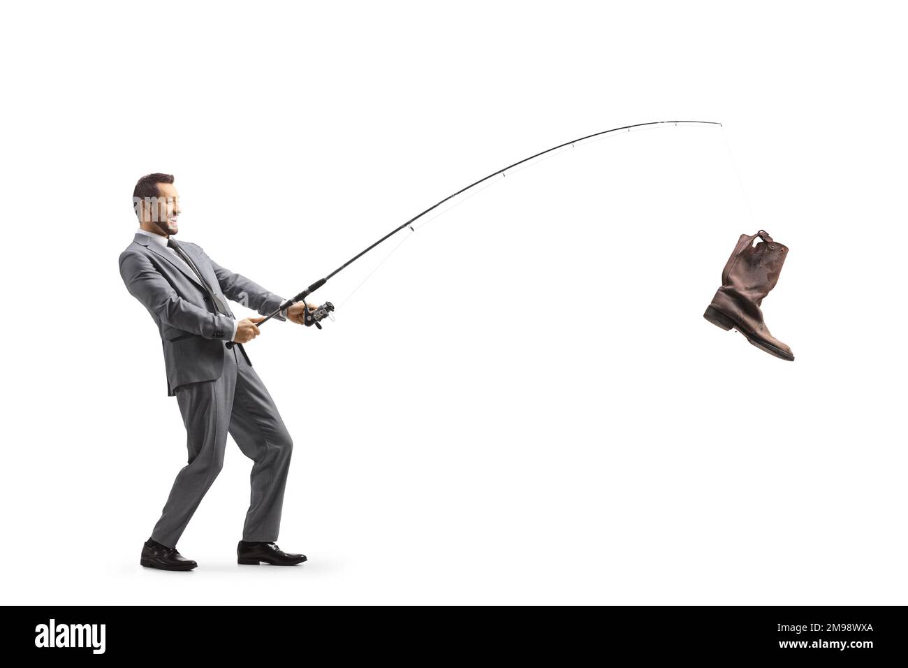Full length profile shot of a businessman with an old boot on a fishing ...