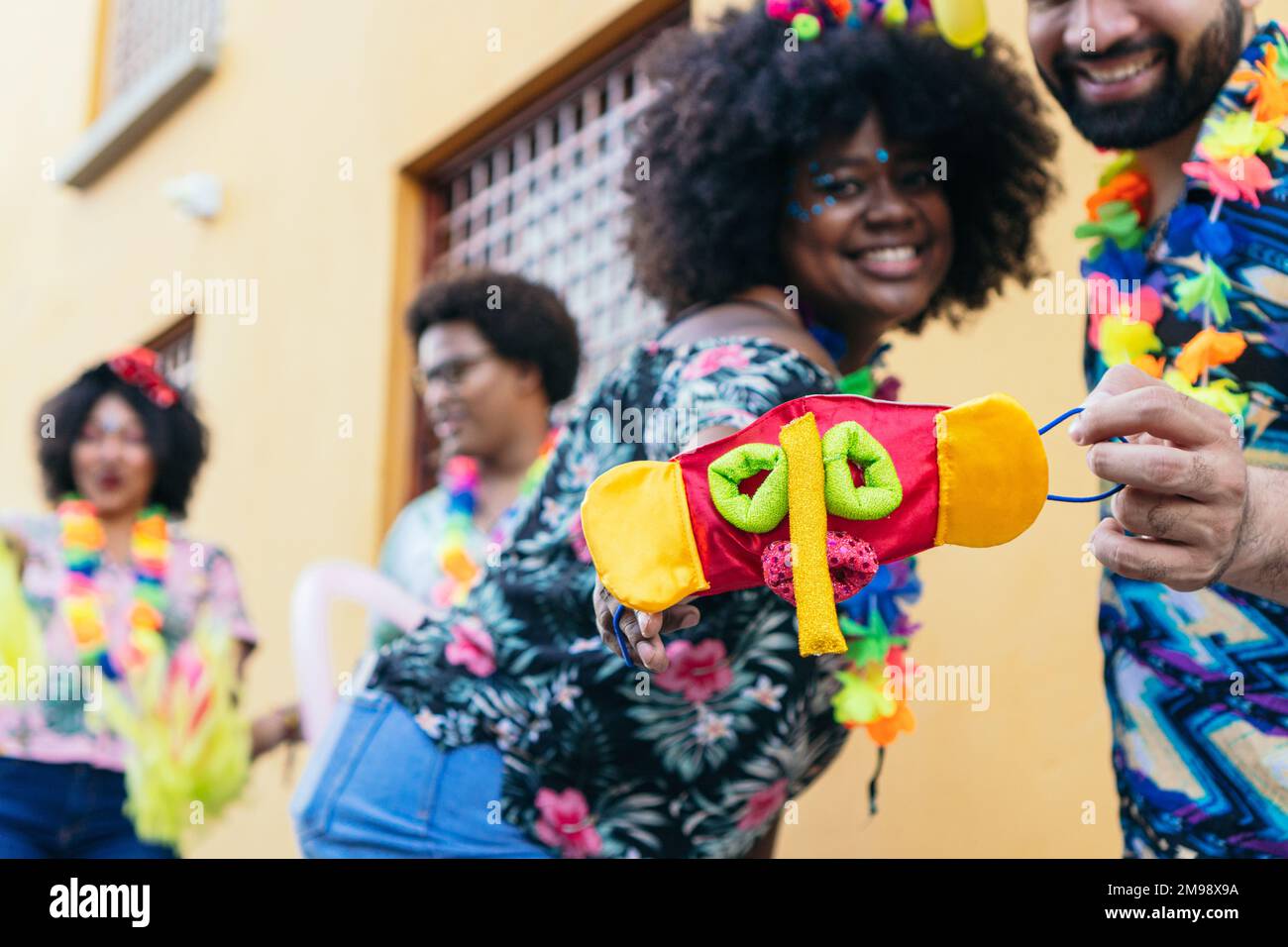 Group of friends enjoying carnival in the streets of Barranquilla ...