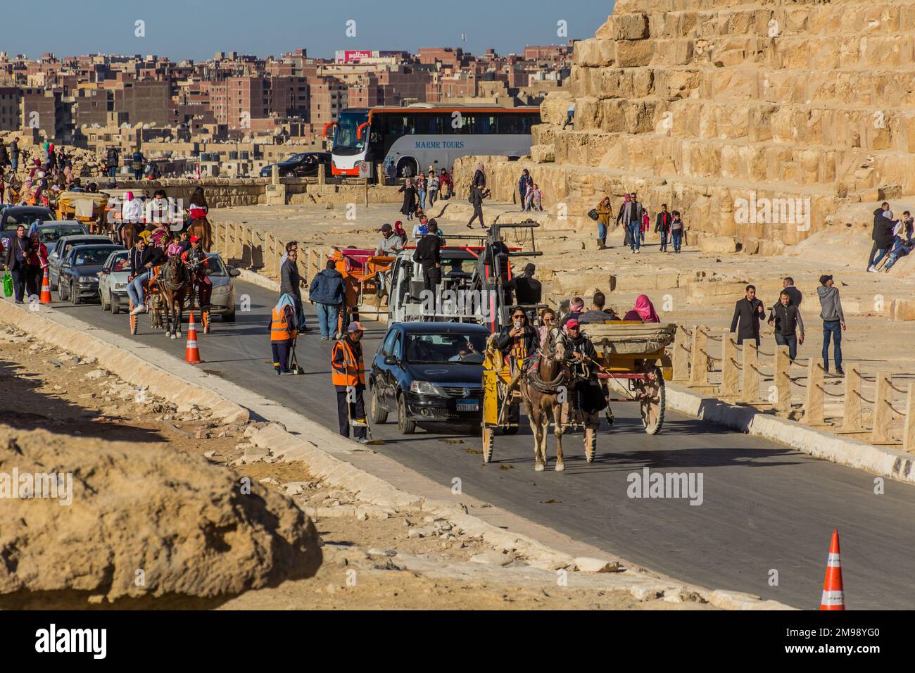 CAIRO, EGYPT - JANUARY 28, 2019: Horse carriages and cars in front of ...