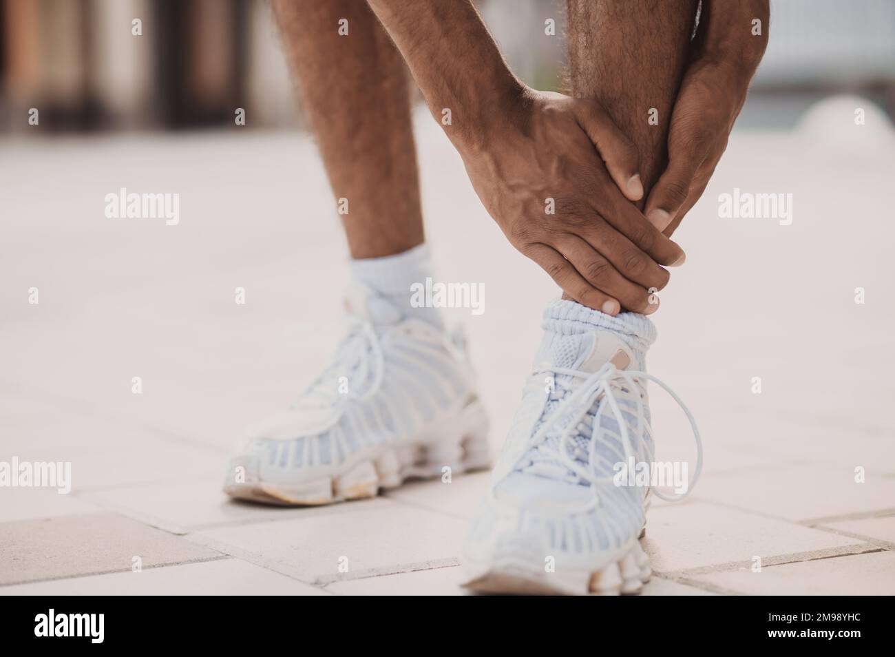 Adult athlete suffering from an acute lower leg pain Stock Photo - Alamy