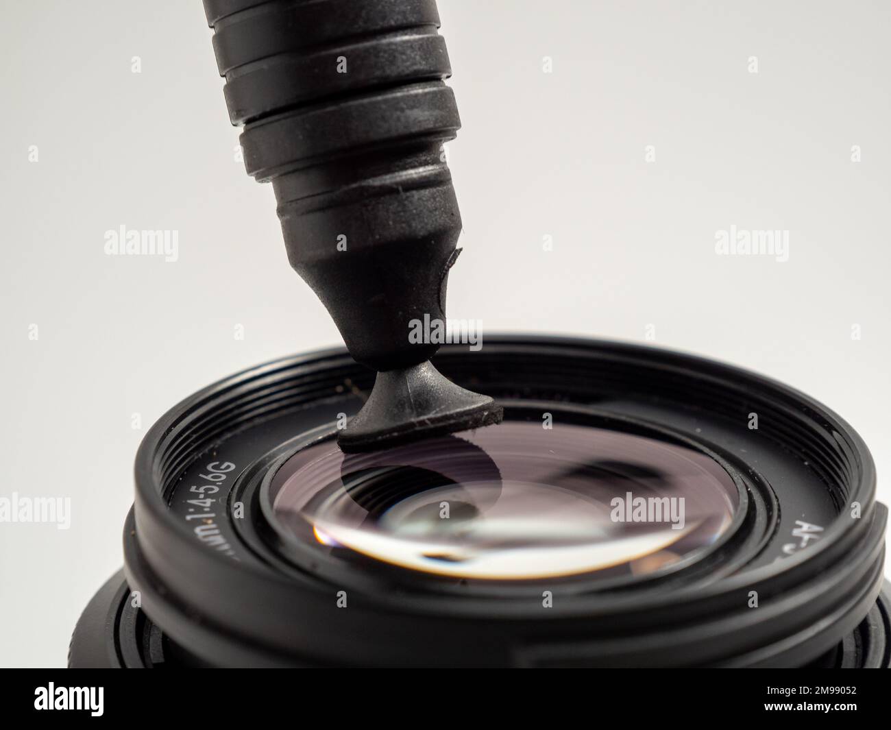 The lens cleaning brush cleans the lens. Brush for cleaning the lens on ...
