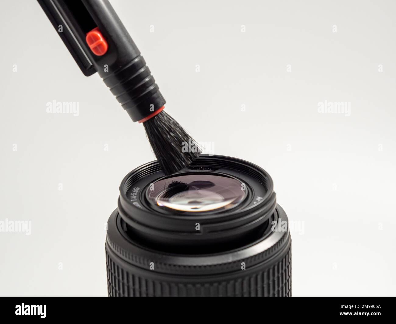 The lens cleaning brush cleans the lens. Brush for cleaning the lens on ...