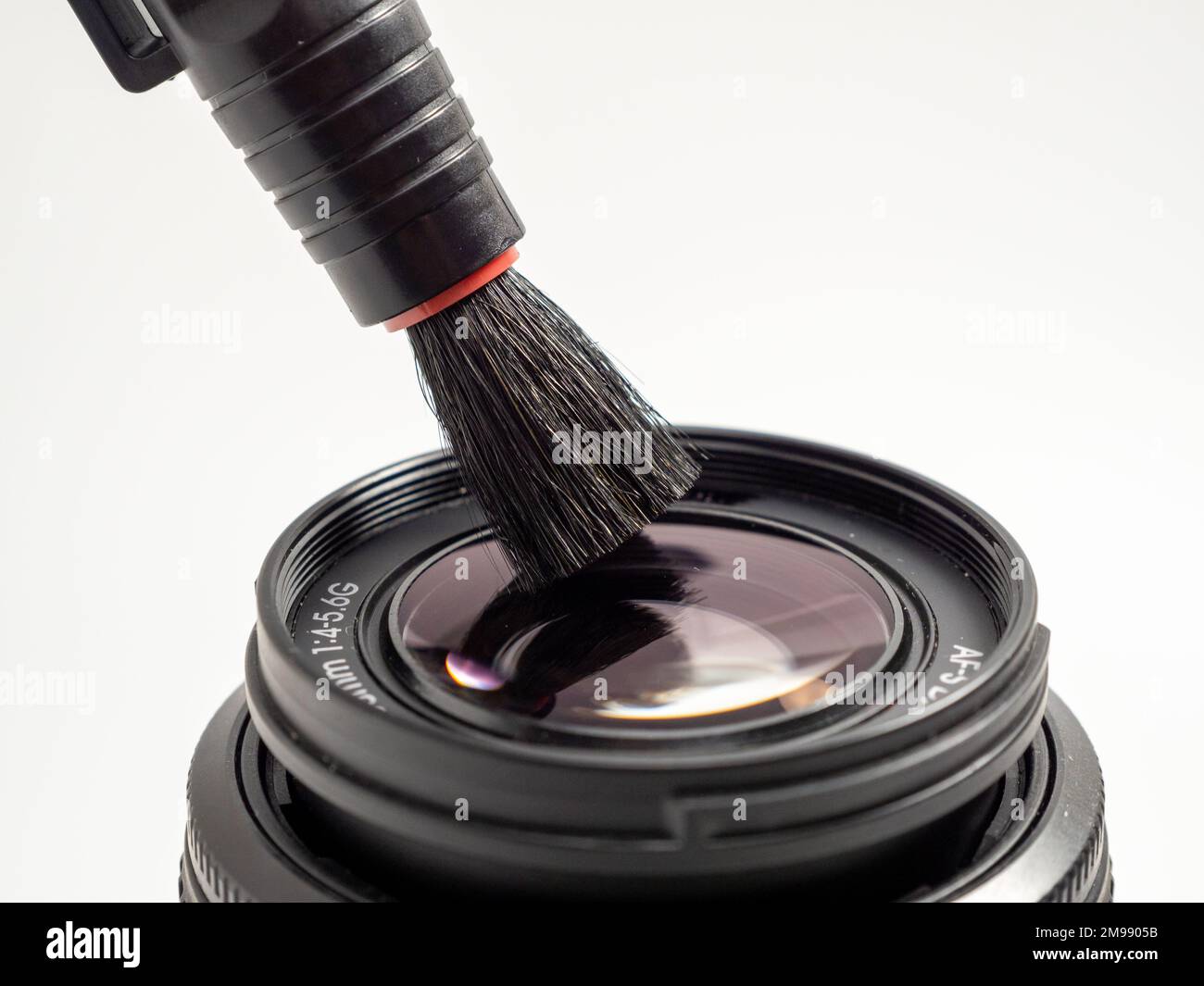 The lens cleaning brush cleans the lens. Brush for cleaning the lens on ...