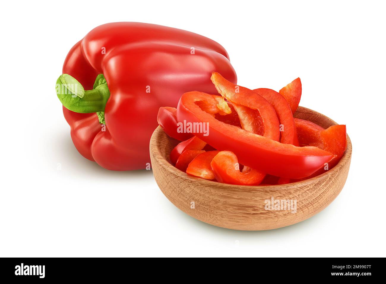 slices of red sweet bell pepper in wooden bowl isolated on white ...