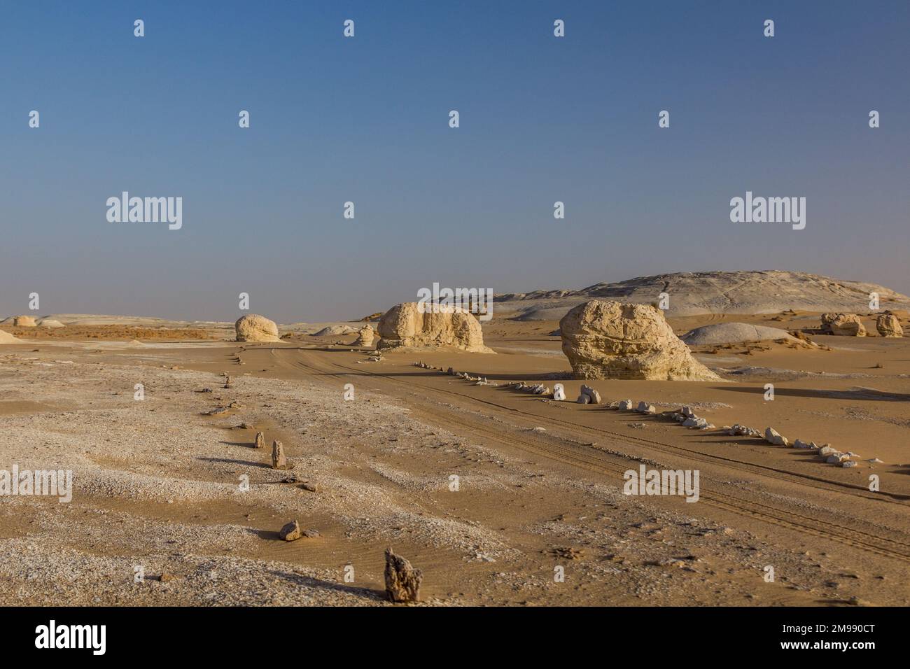 Marked path in the White Desert, Egypt Stock Photo - Alamy