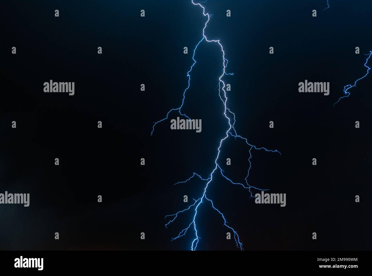 Electric blue lightning in stormy night sky. France Stock Photo - Alamy