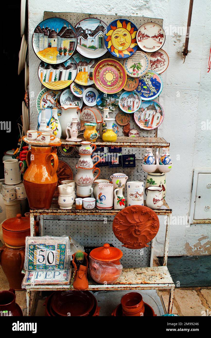 Italy, souvenir shop with pottery in the trulli town of Alberobello ...