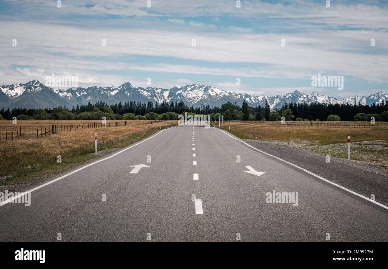 View along the Fairlie to Tekapo road towards the snow capped peaks of ...