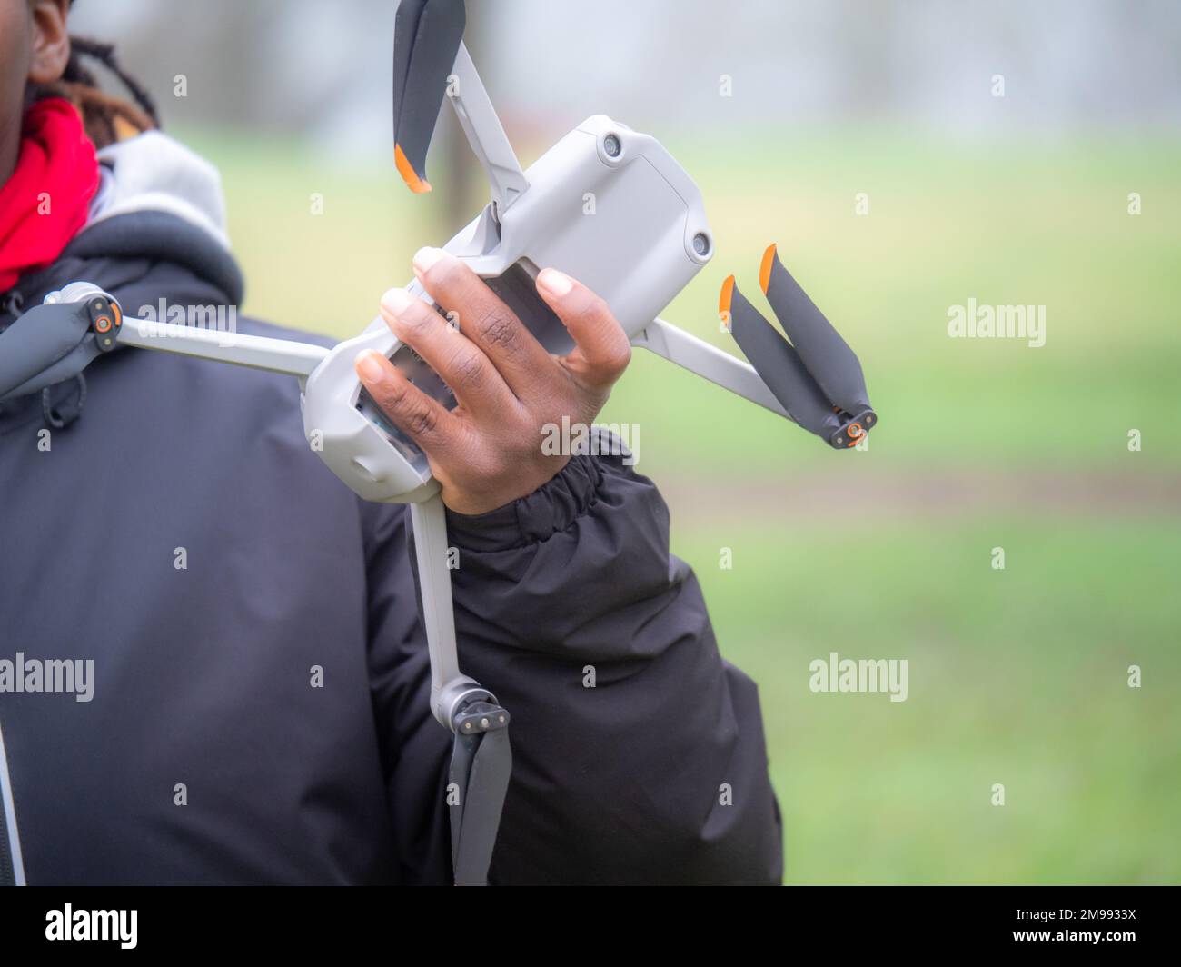 drone flying camera hold by young black african american person ...