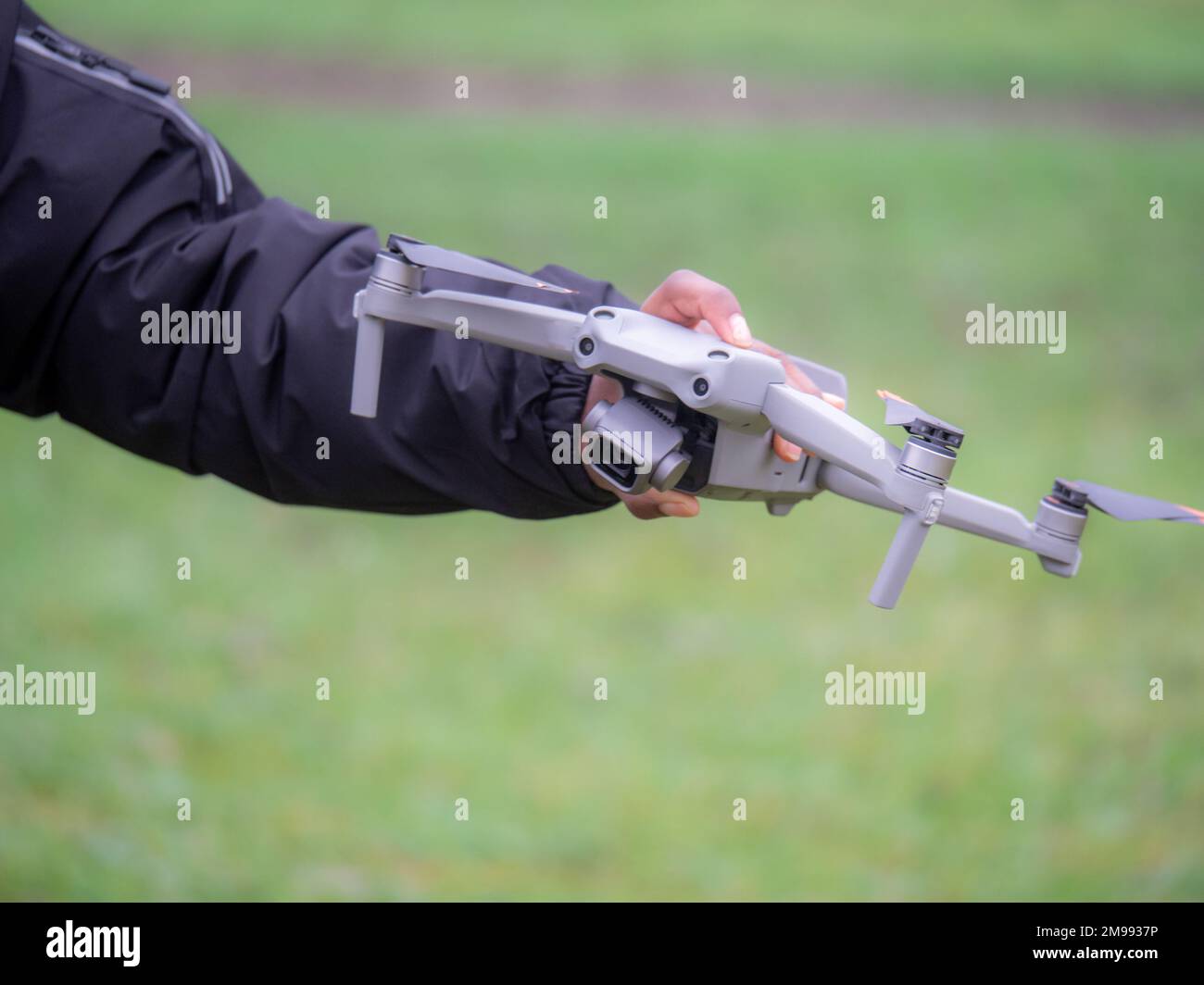 drone flying camera hold by young black african american person ...