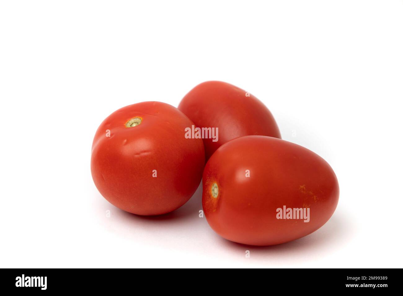 three red tomatoes with white background Stock Photo - Alamy