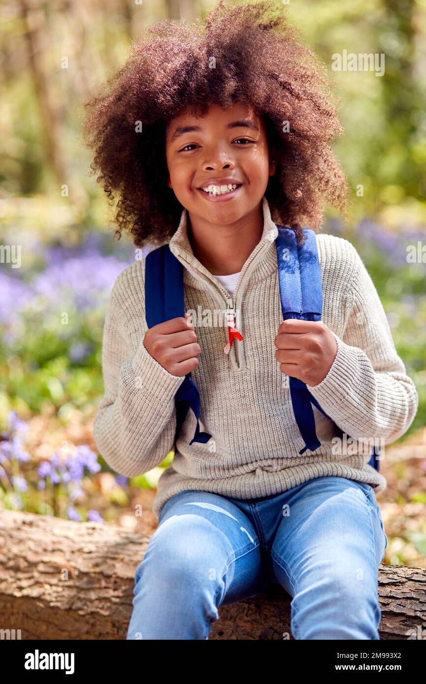 Portrait Of Boy Walking Through Bluebell Woods In Springtime Taking A ...