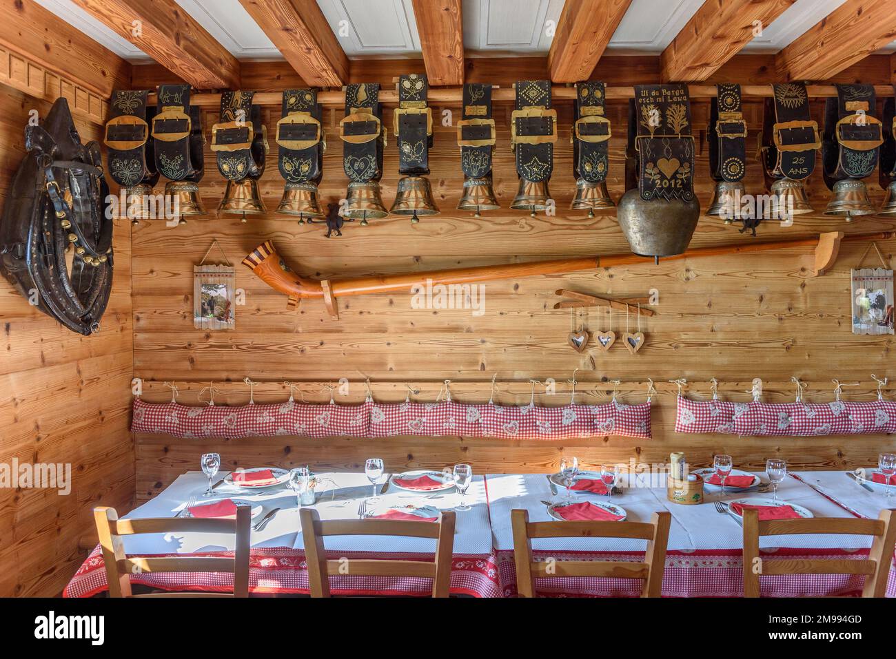 Cow bells displayed in restaurant of mountain farm. Vosges, Alsace ...
