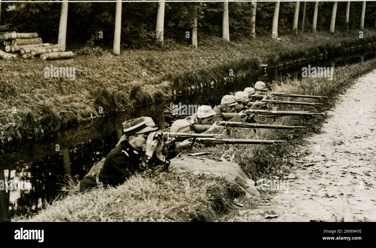 French soldiers with rifles in a trench, photographed on 29 September ...